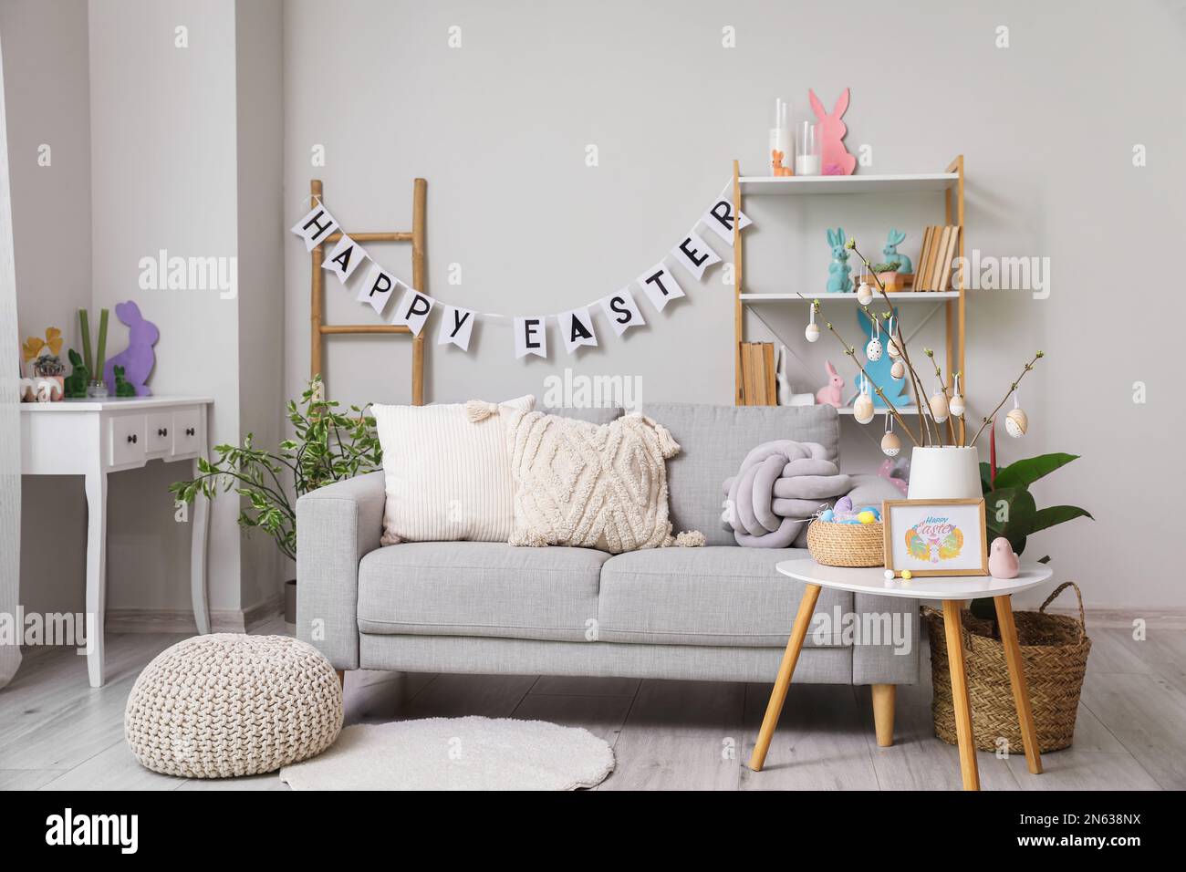 Interior of living room with Easter decor, tables and sofa Stock Photo ...