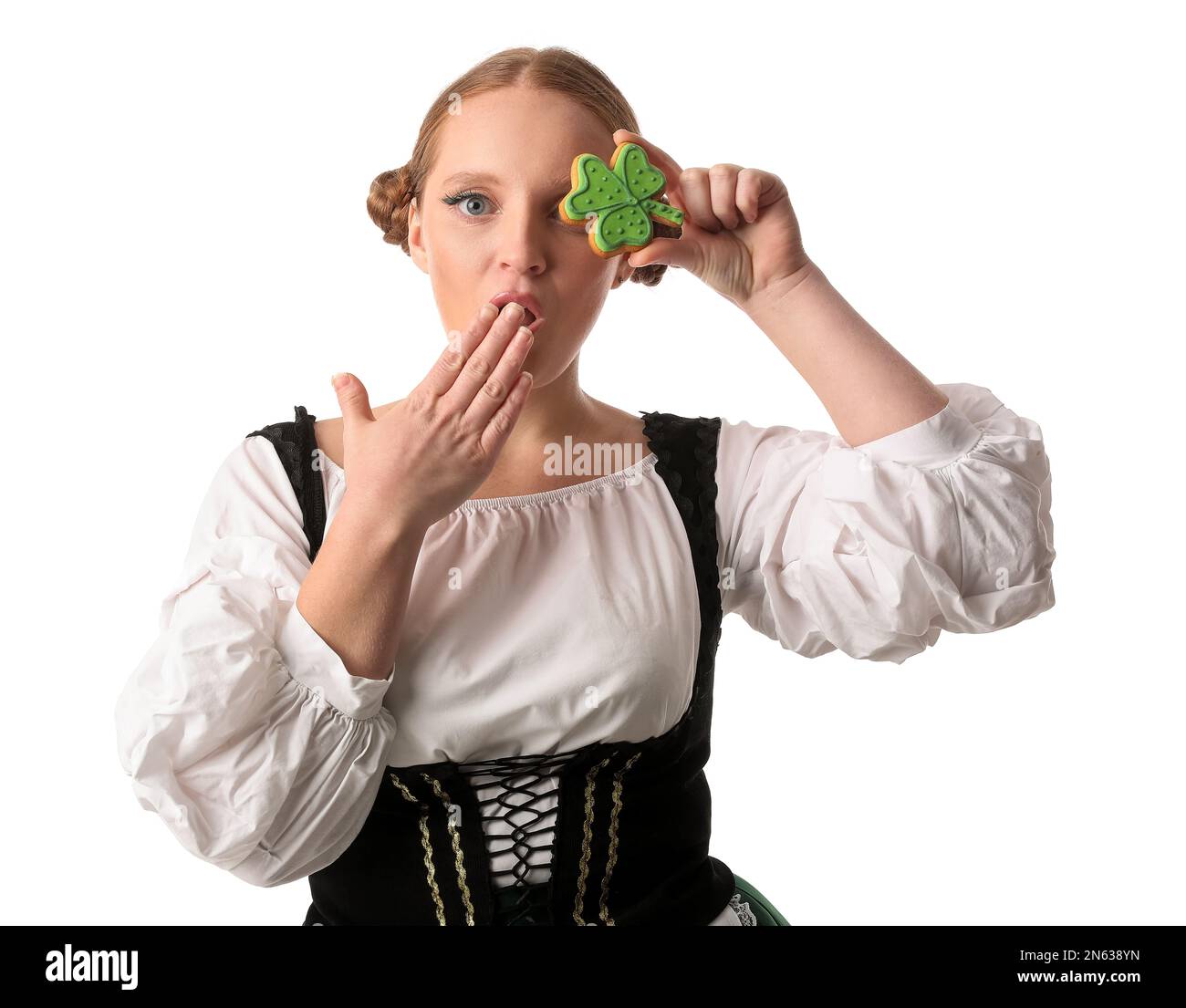 Shocked Irish waitress with cookie on white background. St. Patrick's ...
