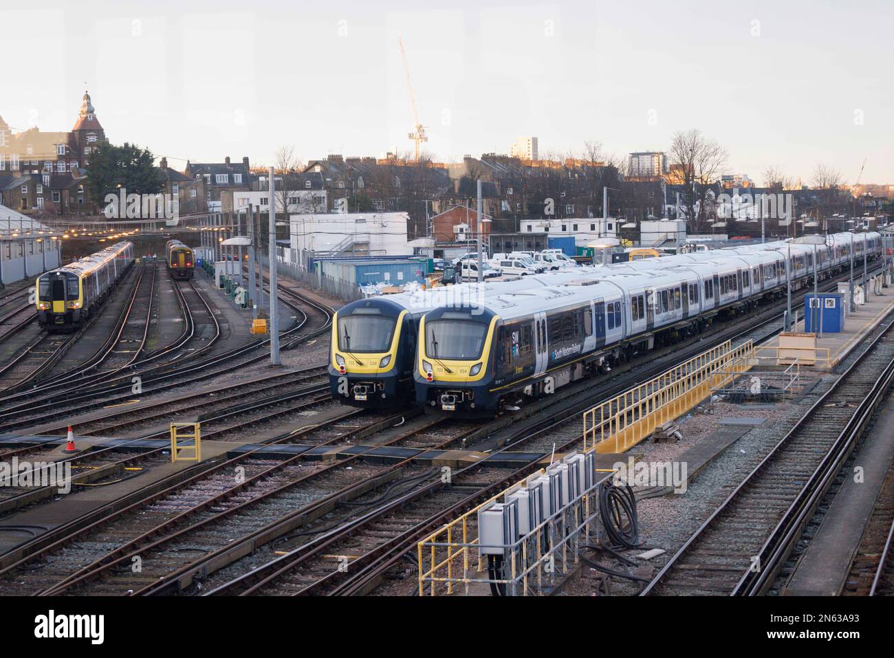 Trains at a train depot at Clapham Junction rail station. Train driver ...