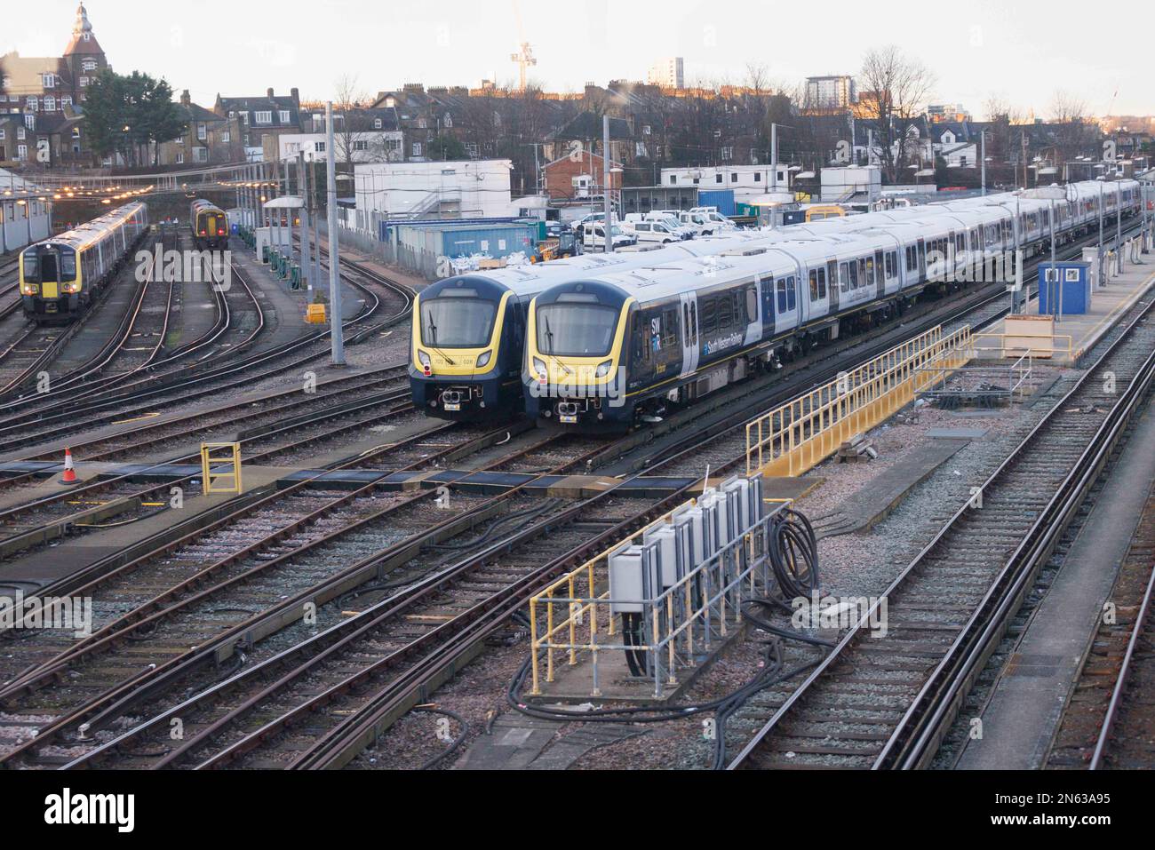 Trains at a train depot at Clapham Junction rail station. Train driver ...