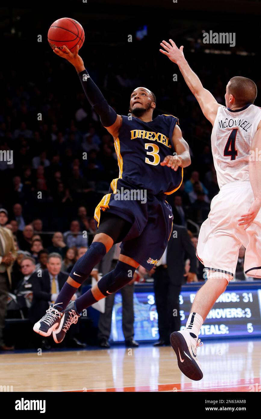 Drexel's Chris Fouch (3) shoots against Arizona's T.J. McConnell (4 ...