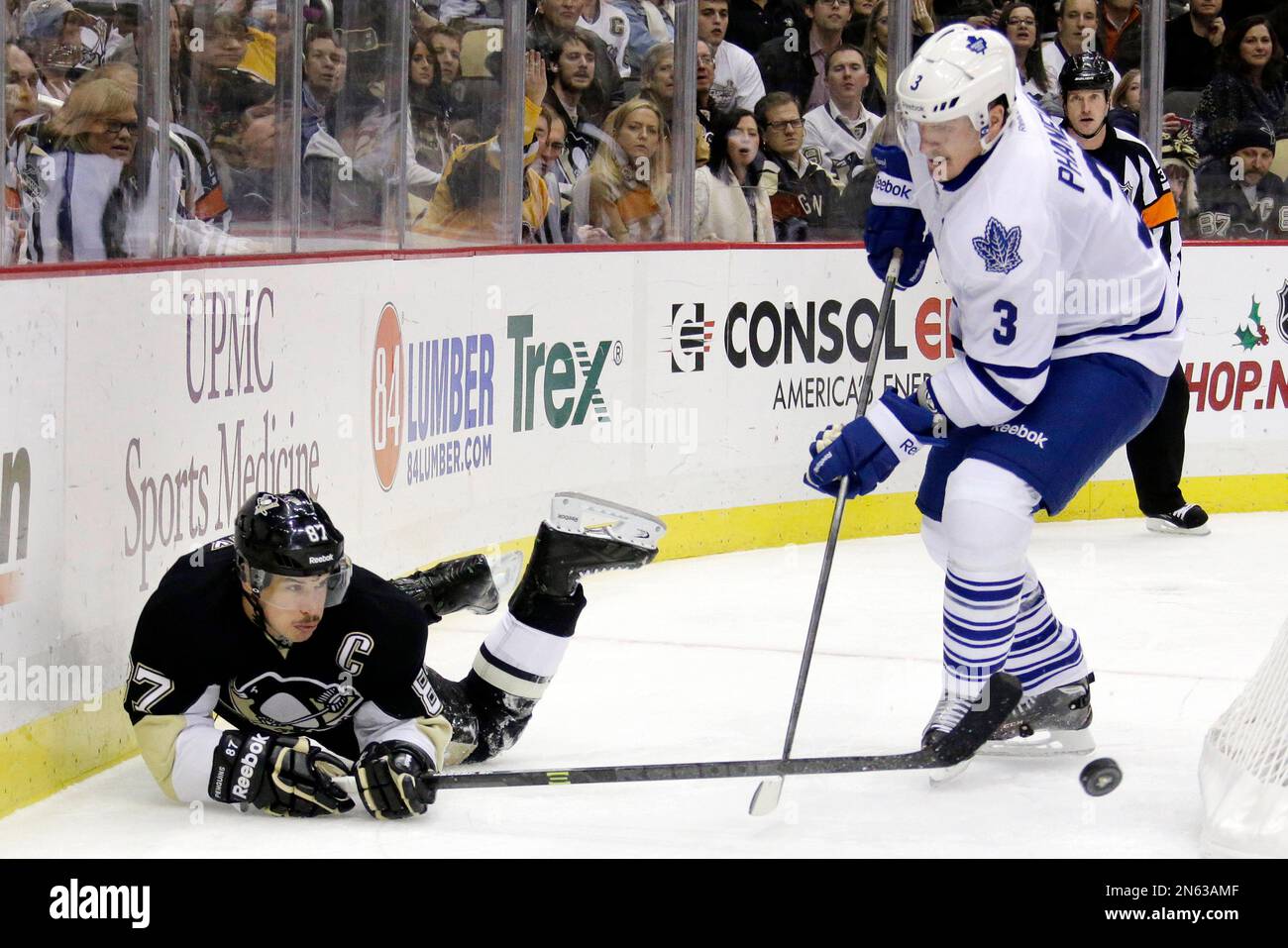 Pittsburgh Penguins' Sidney Crosby, left, gets off a pass around ...