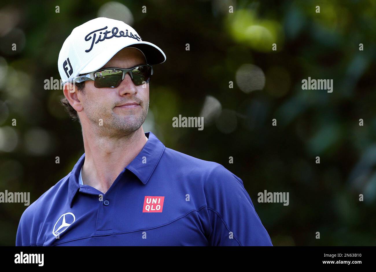 Adam Scott of Australia watches as his ball flies after he teed off on ...