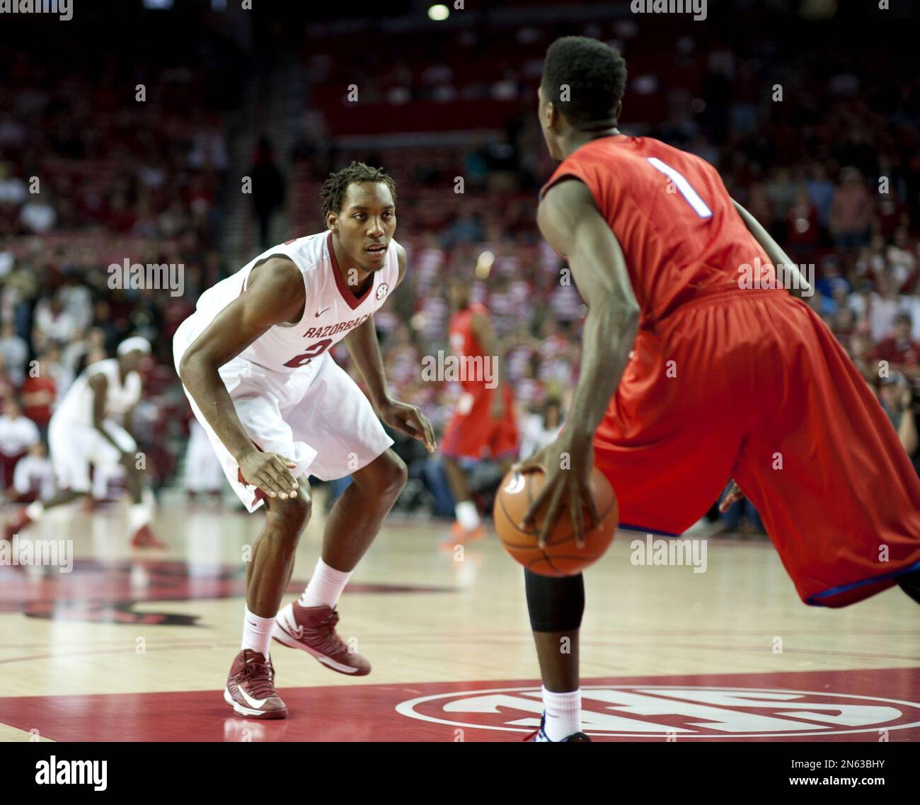 Arkansas' Michael Qualls (24) defends SMU's Ryan Manuel (1) during the ...