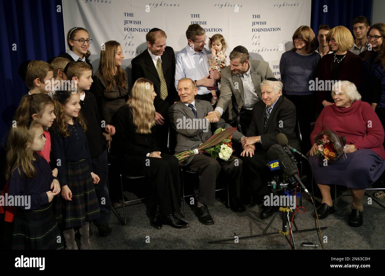 Czeslaw Polziec, of Poland, center, meets members of Leon Gersten's ...