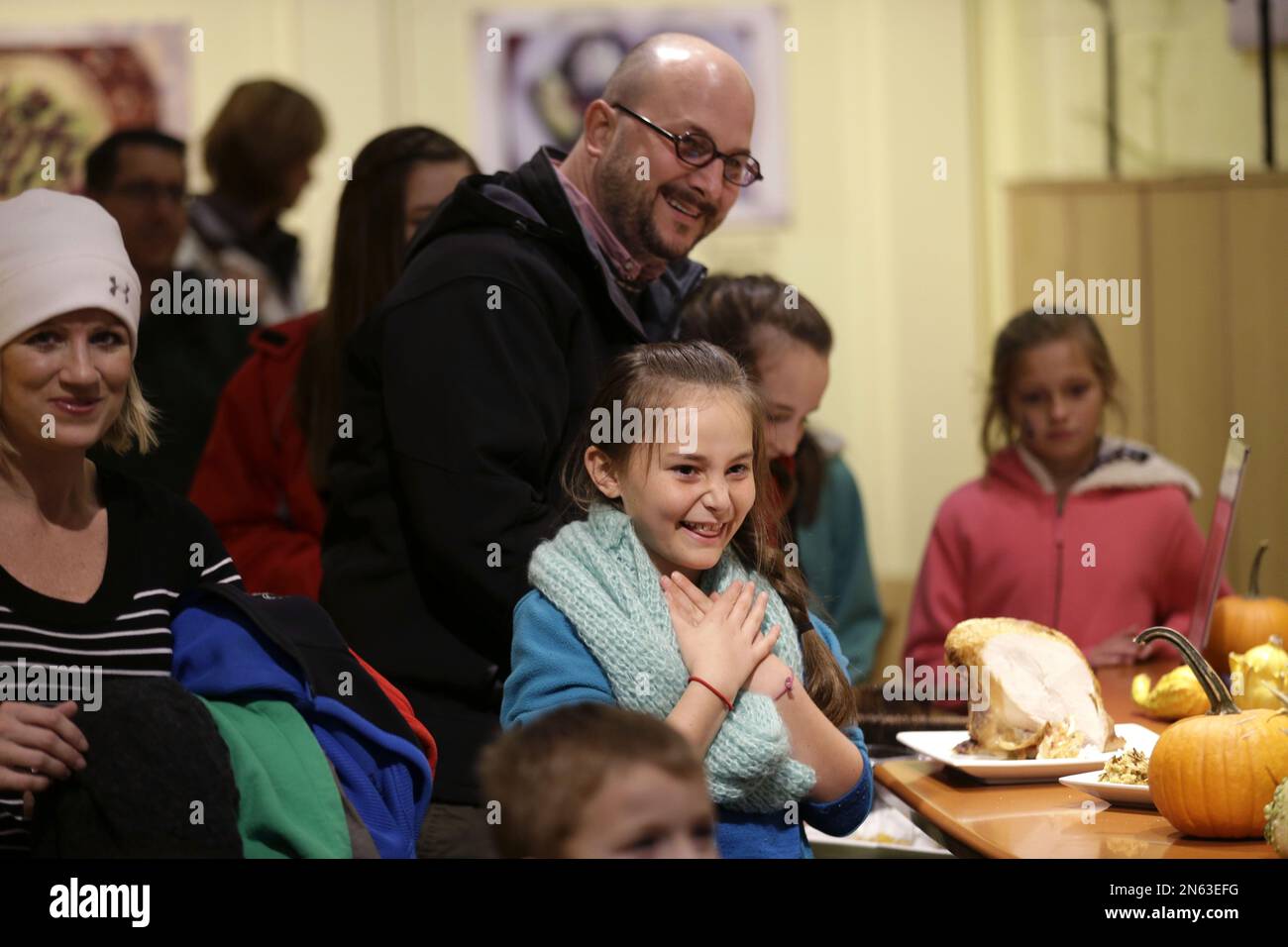 Visitors watch food being prepared with waxworms, mealworms and ...