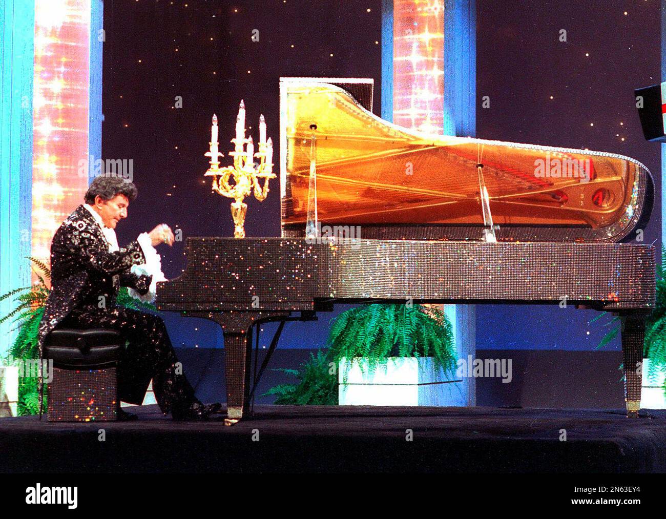FILE - In this Sept. 5, 1984, file photo, Liberace plays the piano on ...