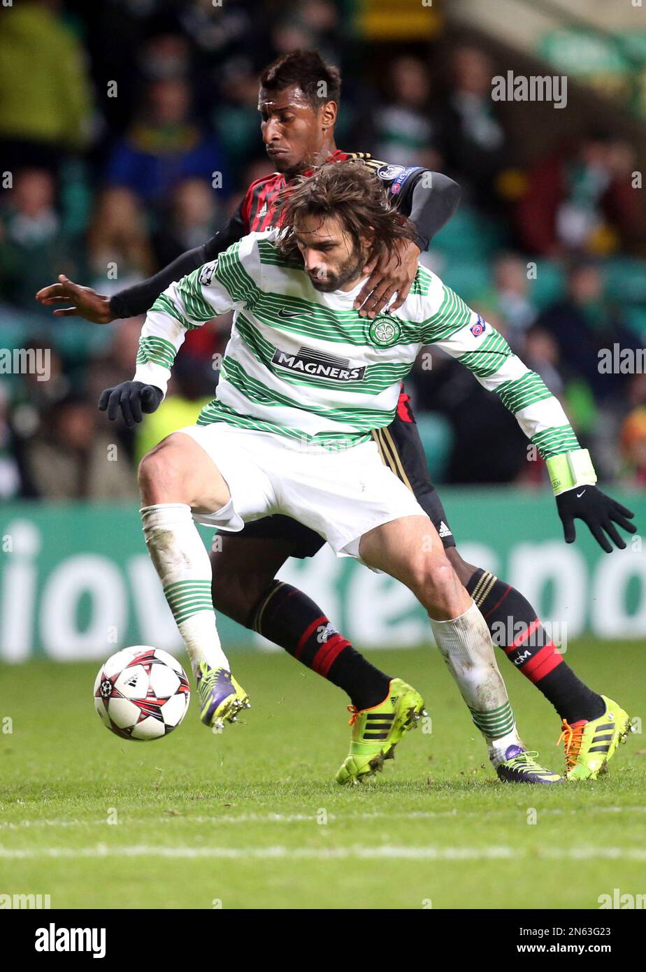 Celtic's Giorgos Samara, foreground, holds back AC Milan's Kevin ...