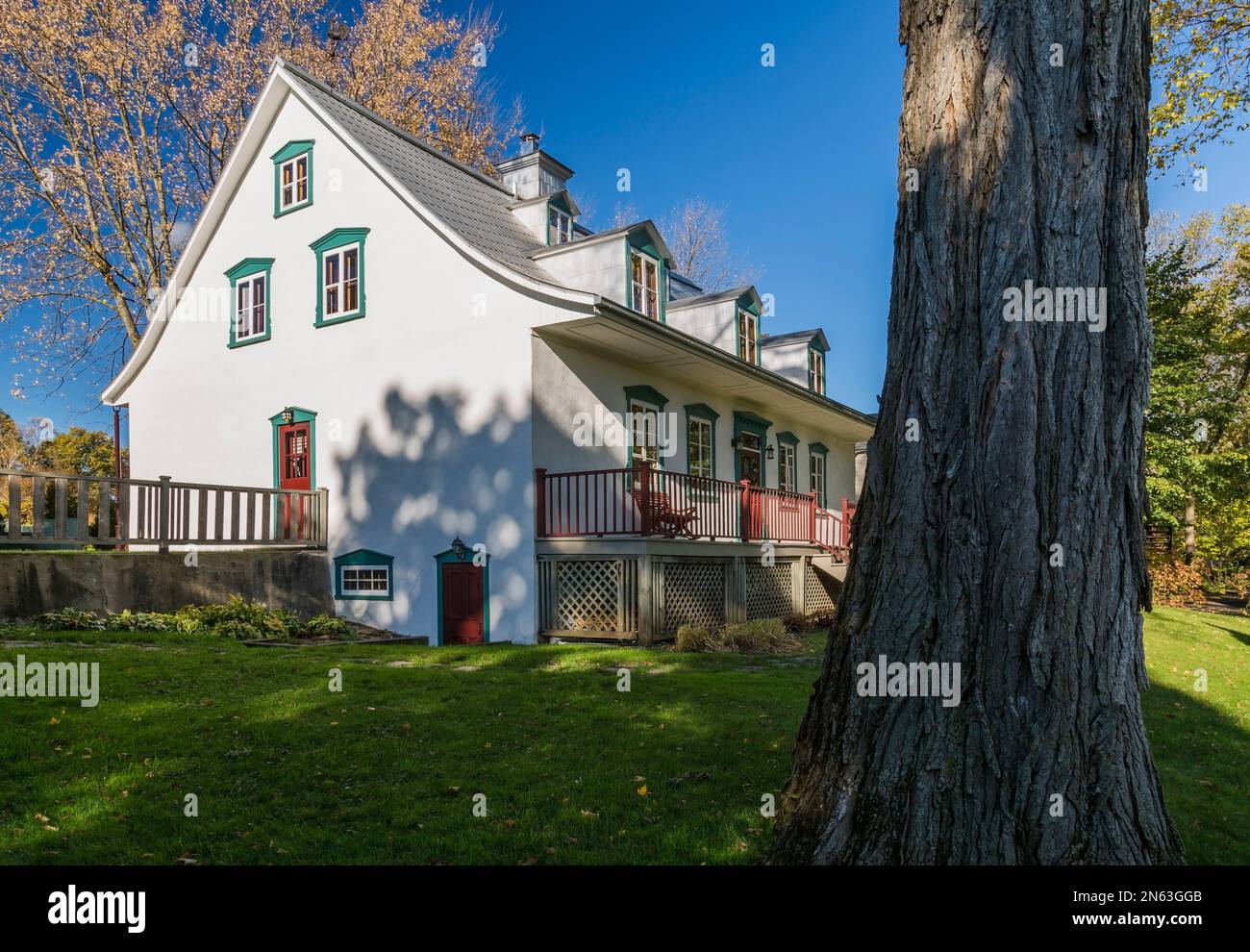 Rear view of old circa 1805 white roughcast with burgundy and green ...