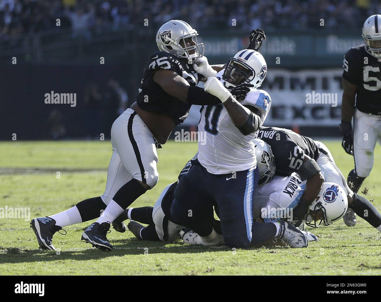 Tennessee Titans offensive guard Chance Warmack, center right, blocks ...