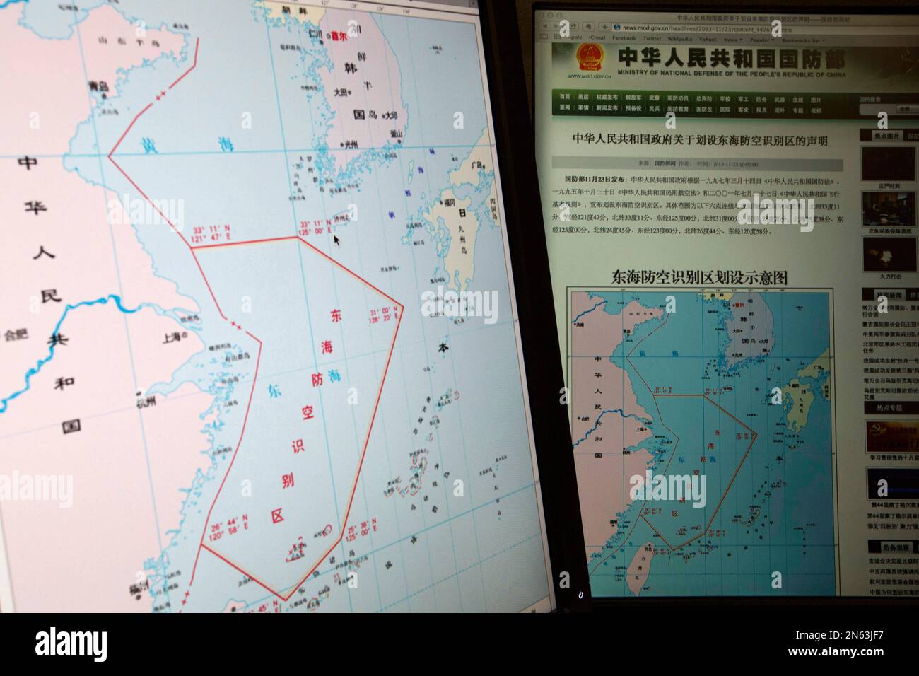 Computer screens display a map showing the outline of China's new air ...