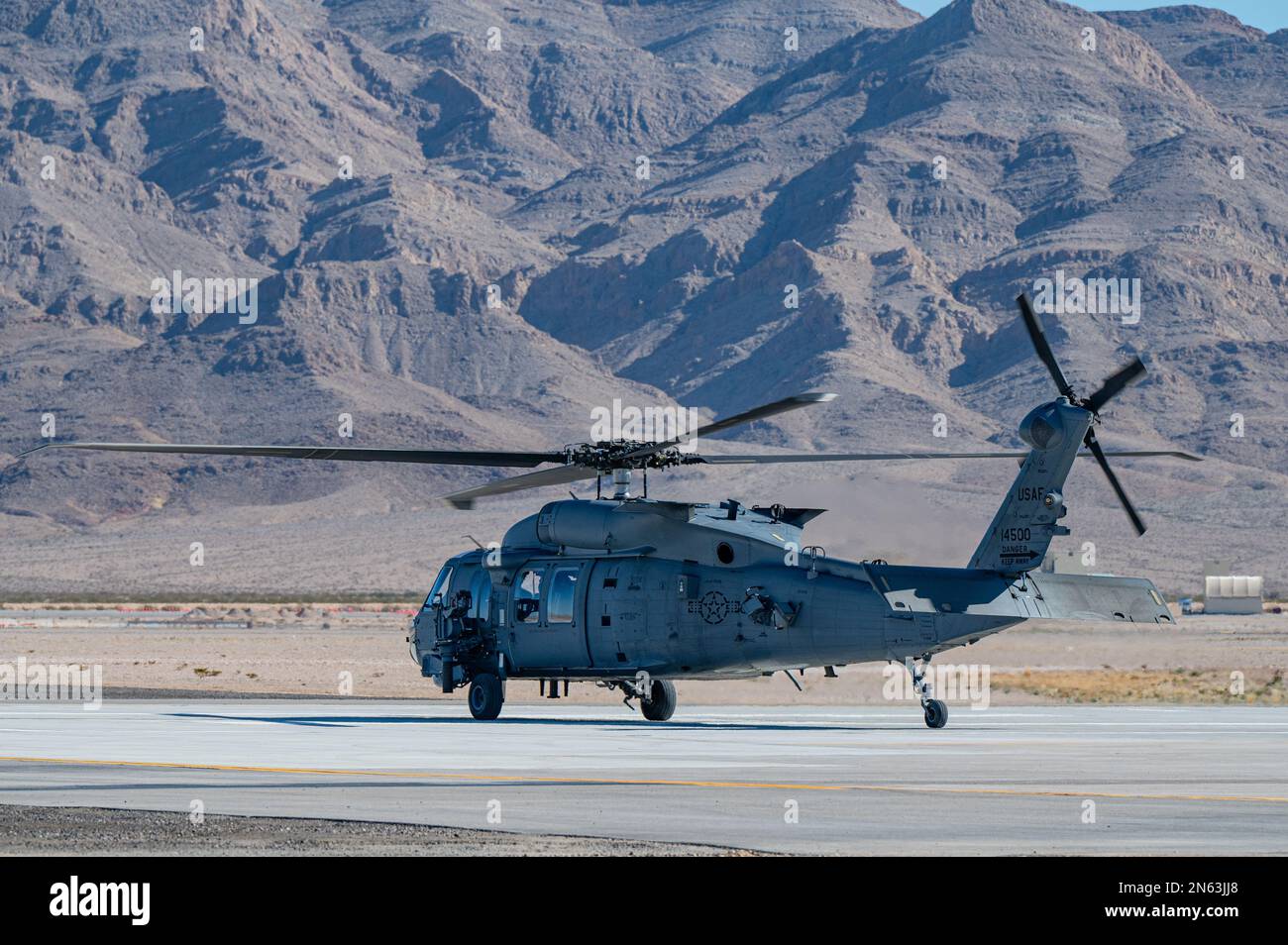 An HH-60W Jolly Green II helicopter from the 66th Rescue Squadron taxis ...