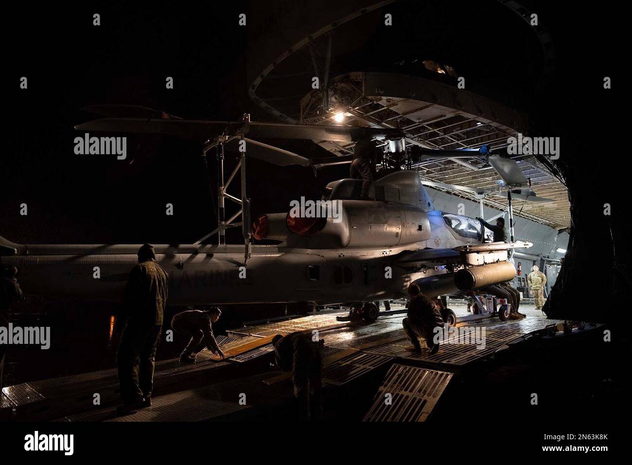 U.S. Airmen assigned to the 22nd Airlift Squadron and U.S. Marines ...