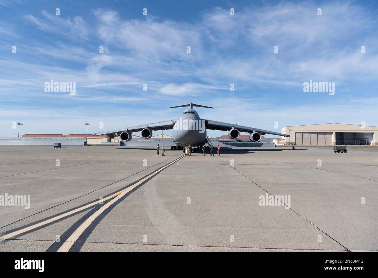 A C-5M Super Galaxy sits on the flightline during preflight inspections ...