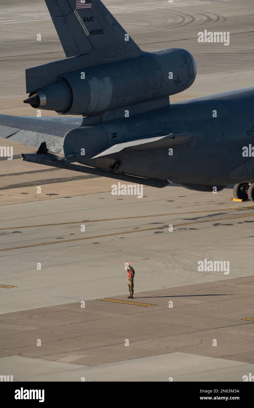 A U.S. Airman marshals a KC-10 Extender during an integrated mission ...