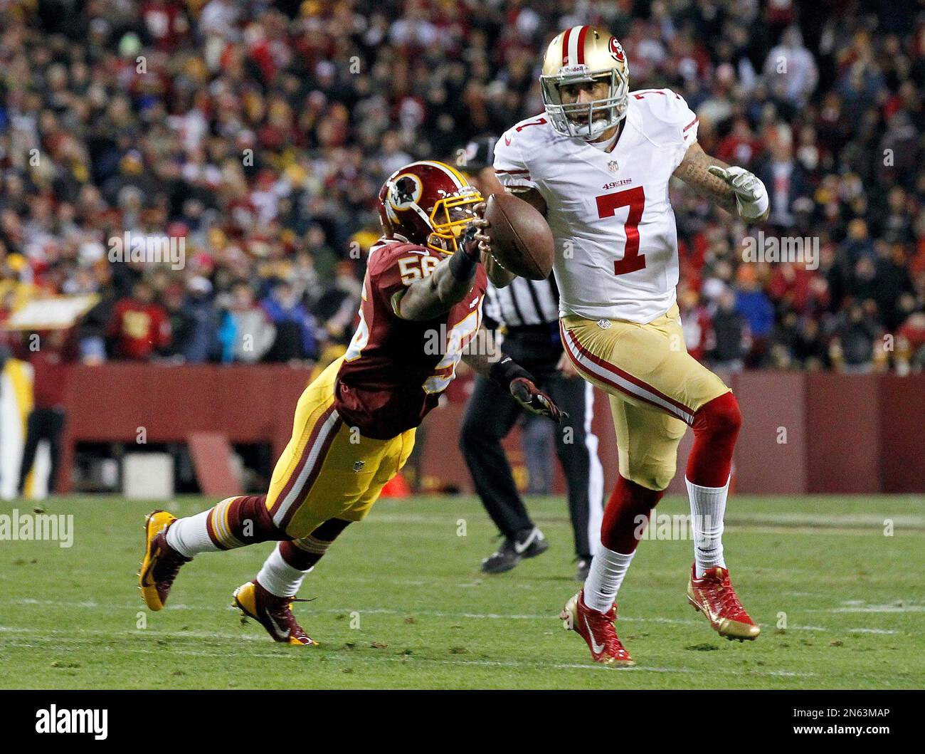 San Francisco 49ers quarterback Colin Kaepernick runs out of the reach ...