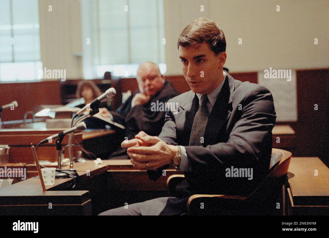 Long Island Railroad massacre victim Mark Heaney demonstrates how the ...