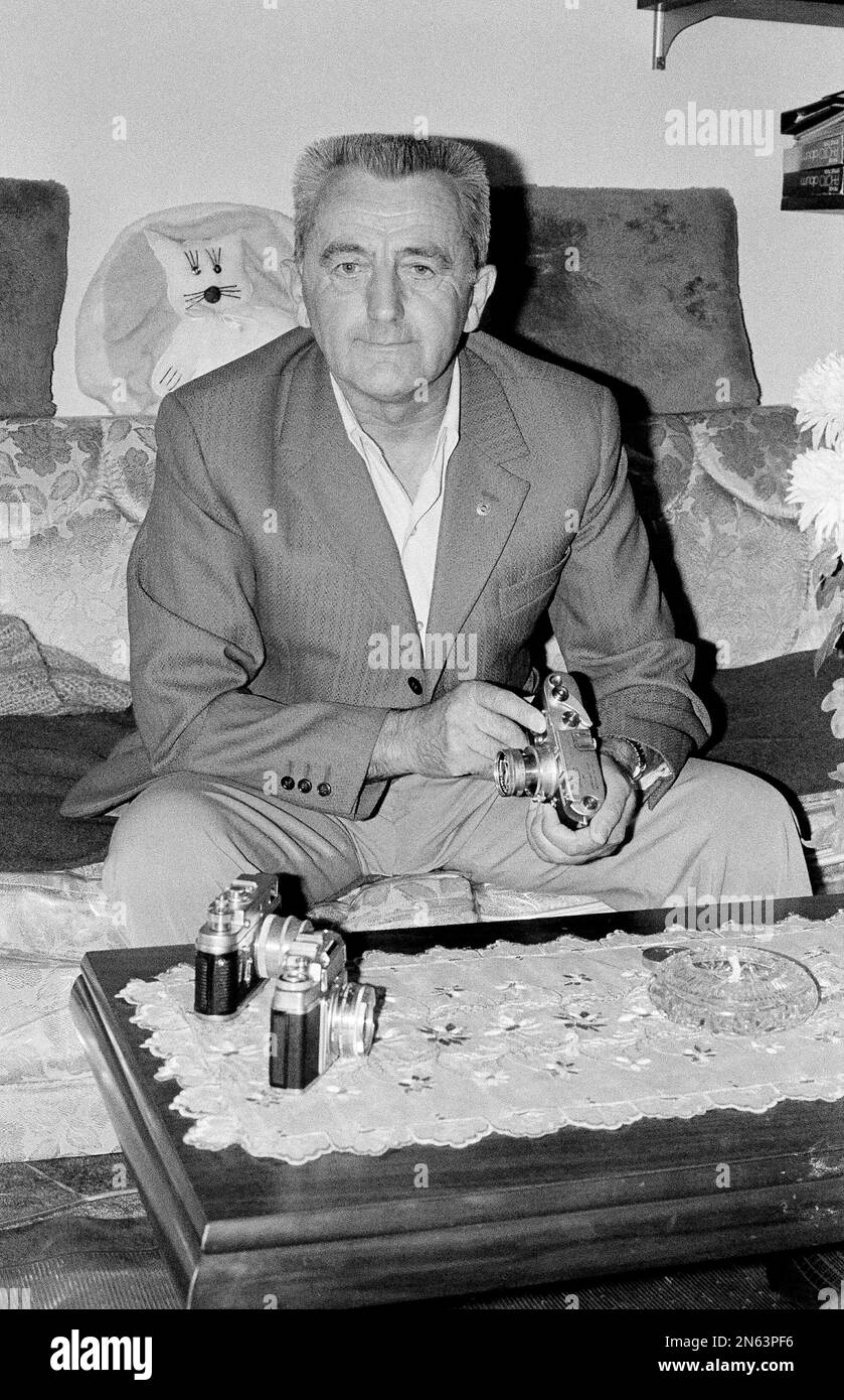 Frank Walus is shown discussing his photography hobby in his Chicago ...