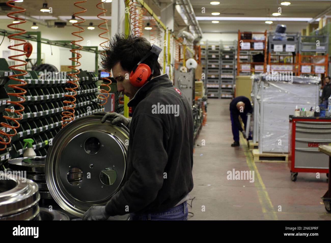 Production line at the Comac factory in San Giovanni Lupatoto, near ...
