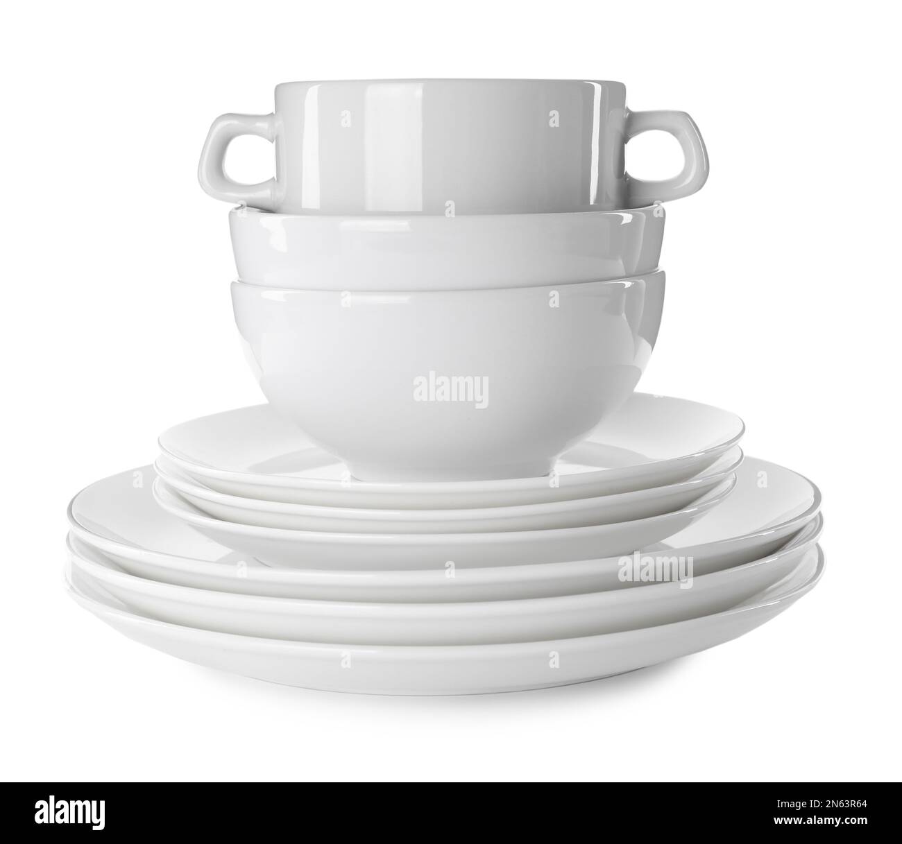 Stack of clean tableware isolated on white Stock Photo - Alamy