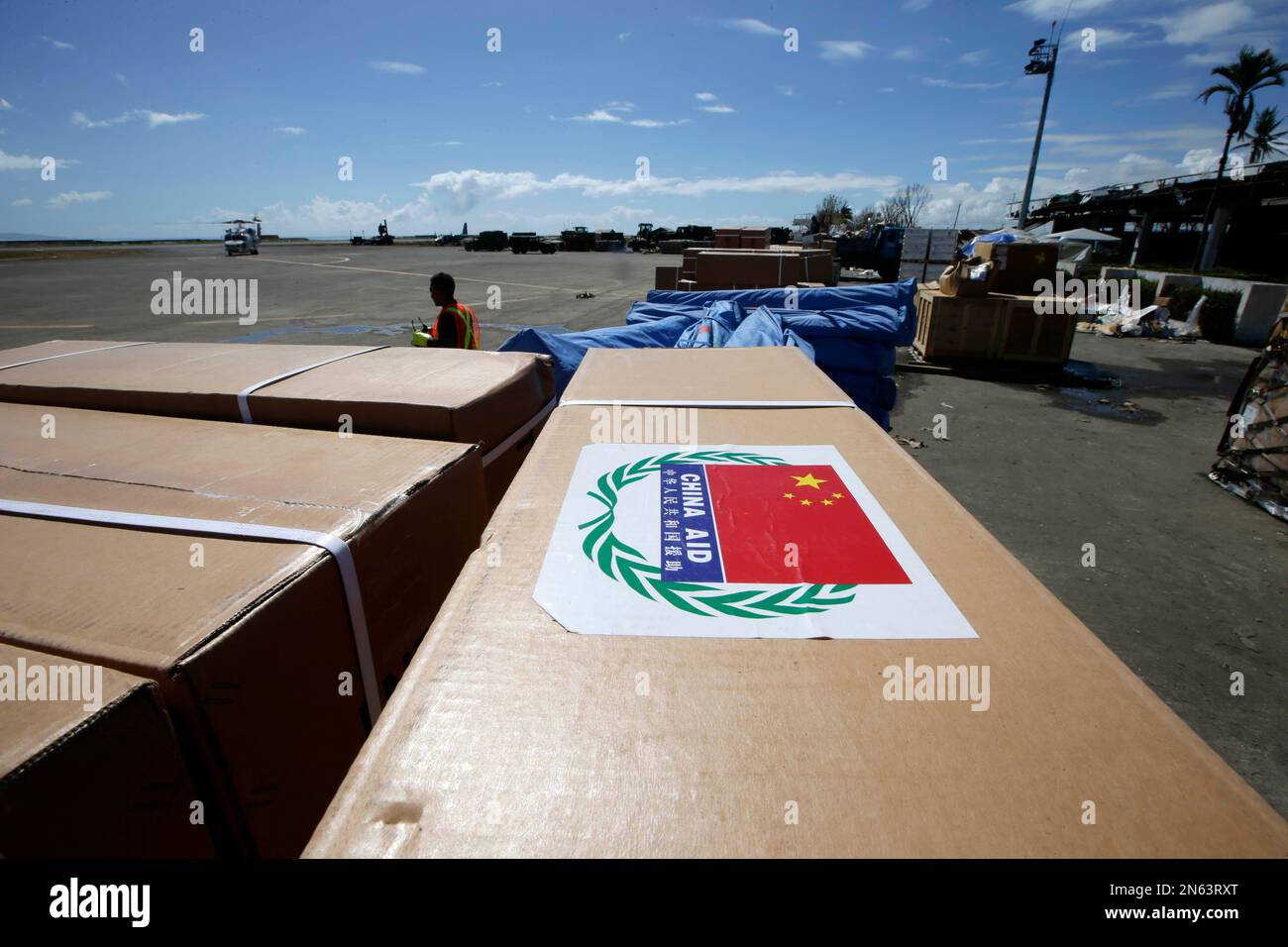 Boxes of tents and other relief material from China wait to be ...