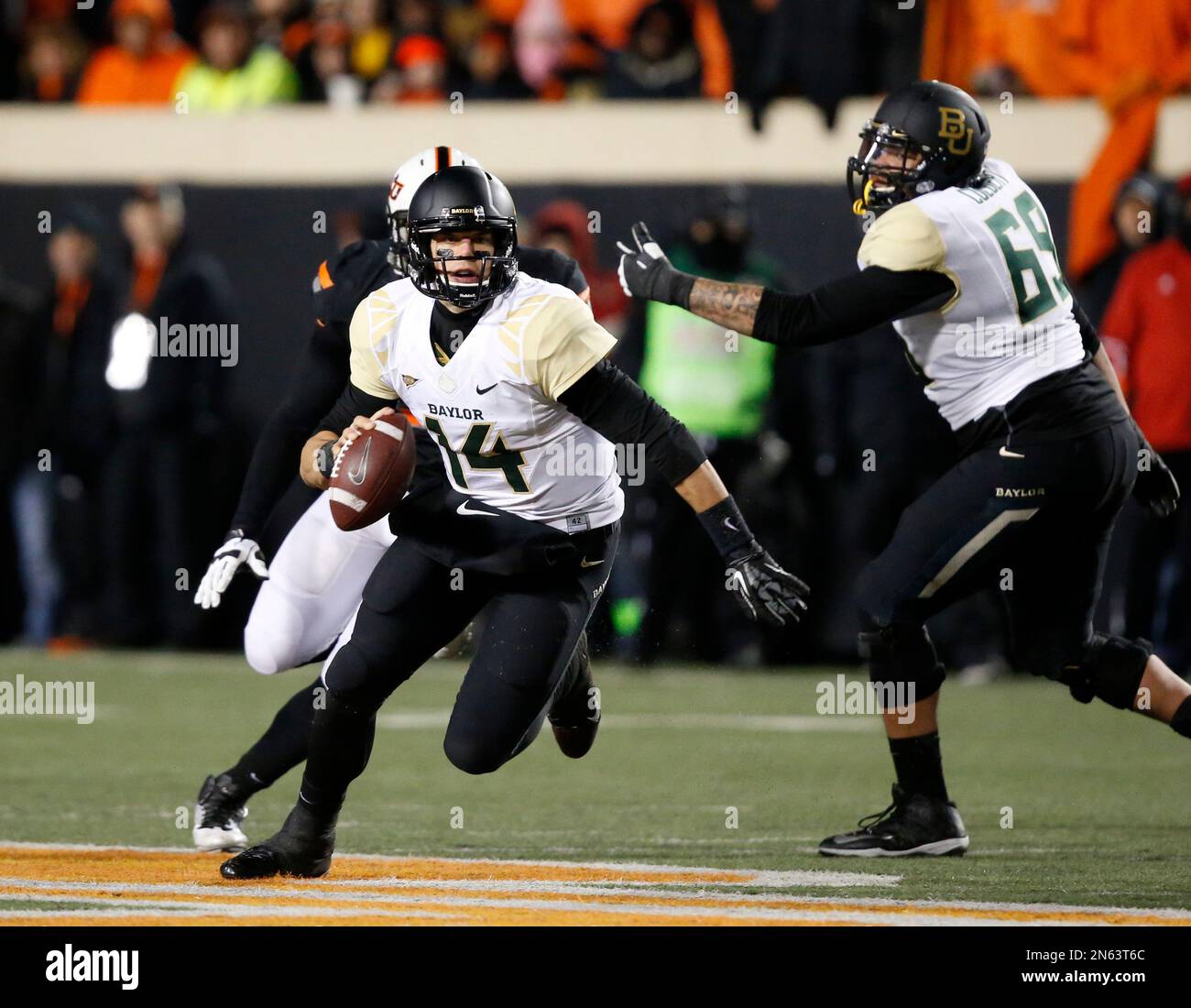 Baylor quarterback Bryce Petty (14) carries against Oklahoma State in ...