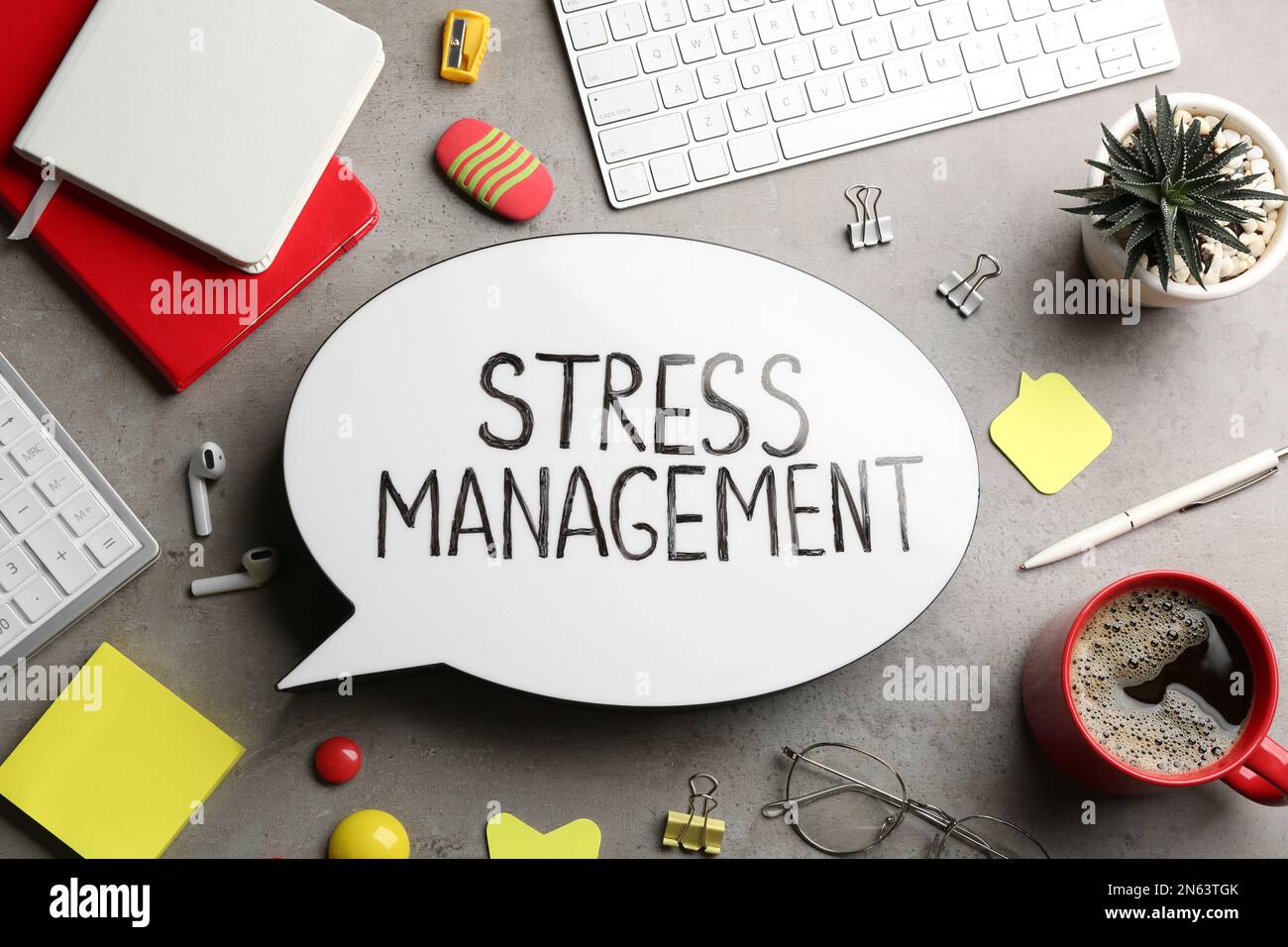 Flat lay composition with words Stress Management and office supplies ...