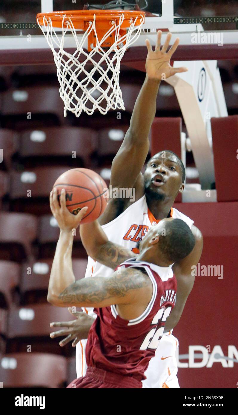 Clemson's Landry Nnoko, back, tries to block the shot of Massachusetts ...