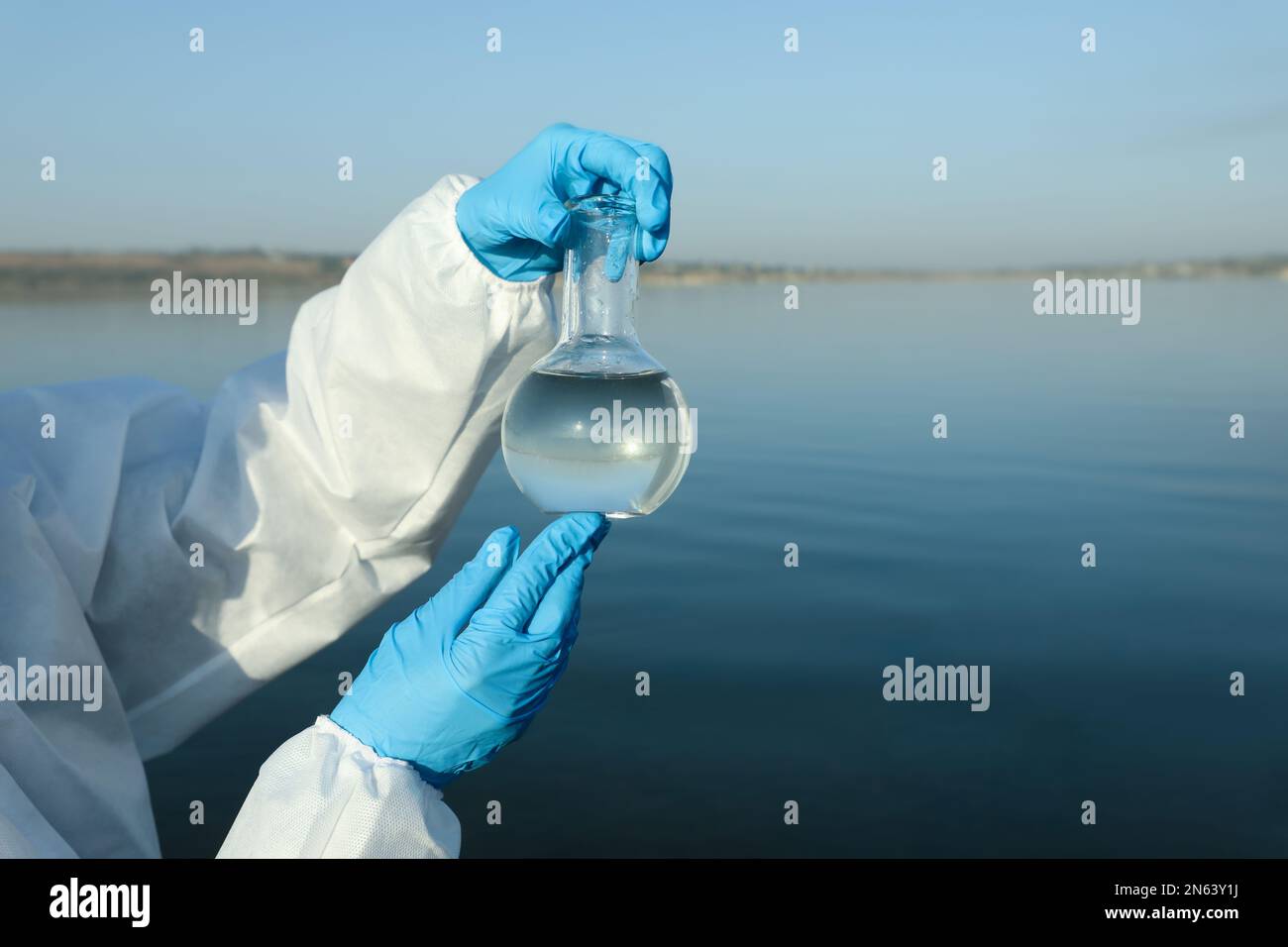 Environmental scientist taking water sample hi-res stock photography ...