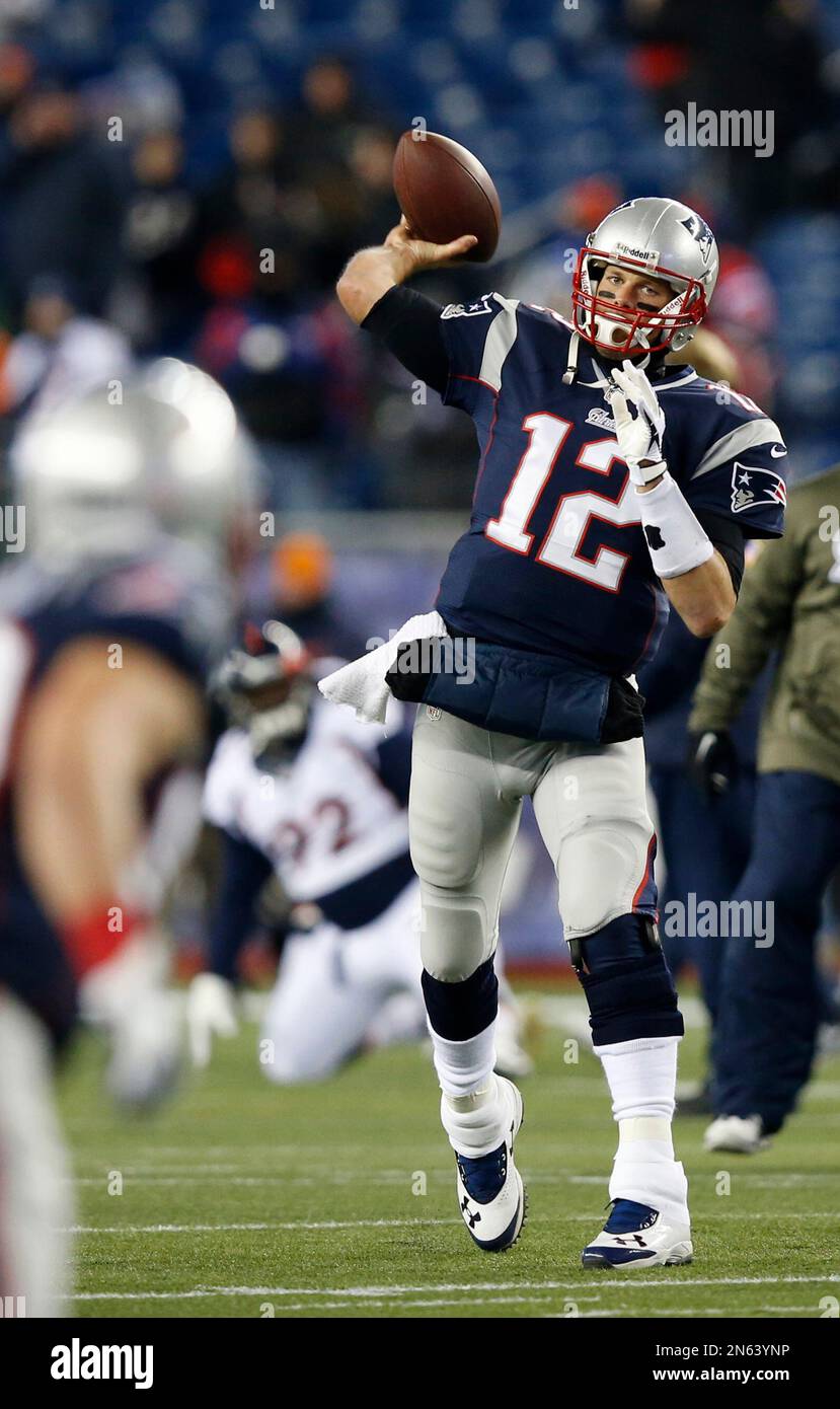 New England Patriots quarterback Tom Brady warms up before an NFL ...