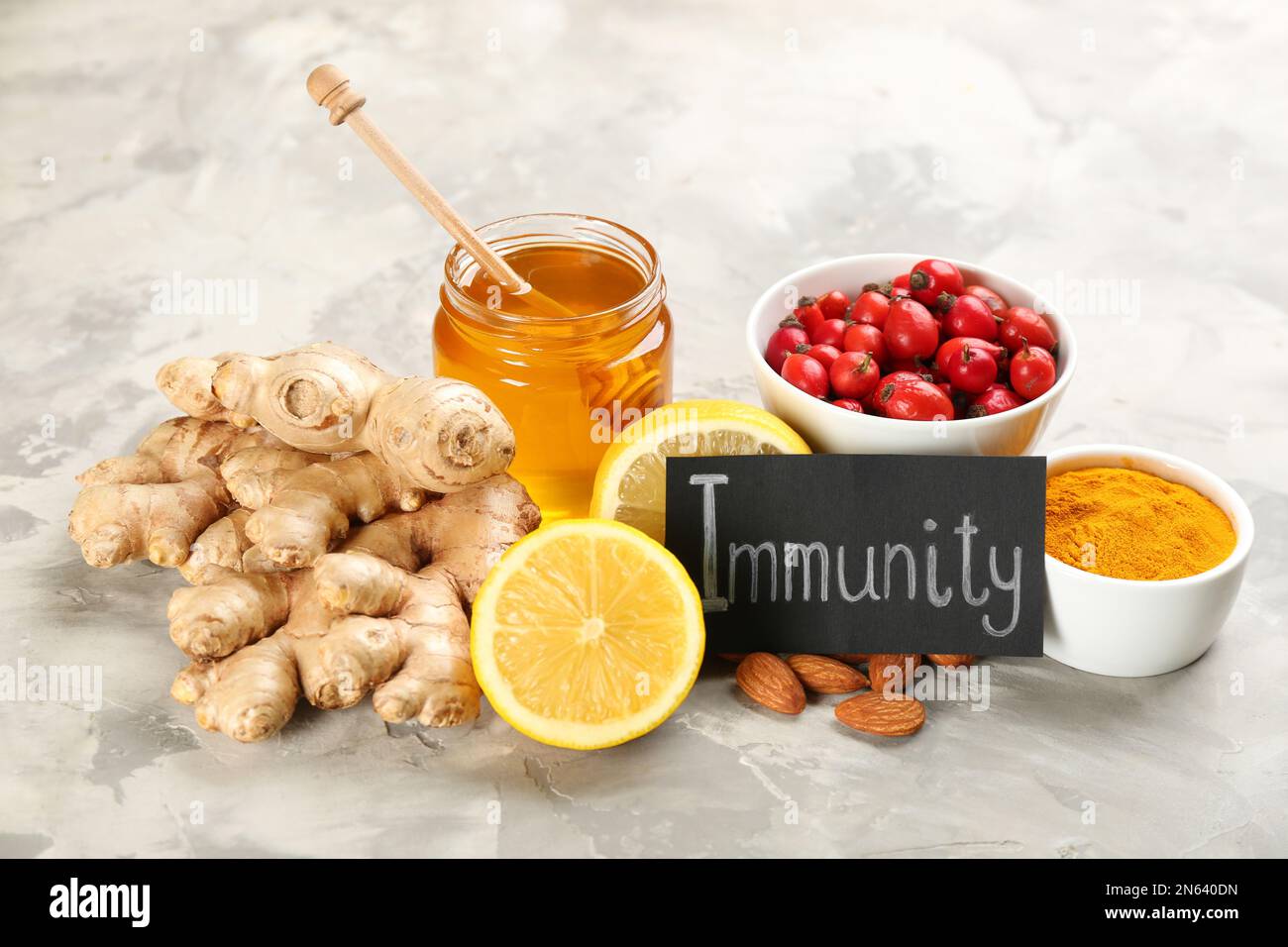 Card with word Immunity and fresh products on light marble background ...