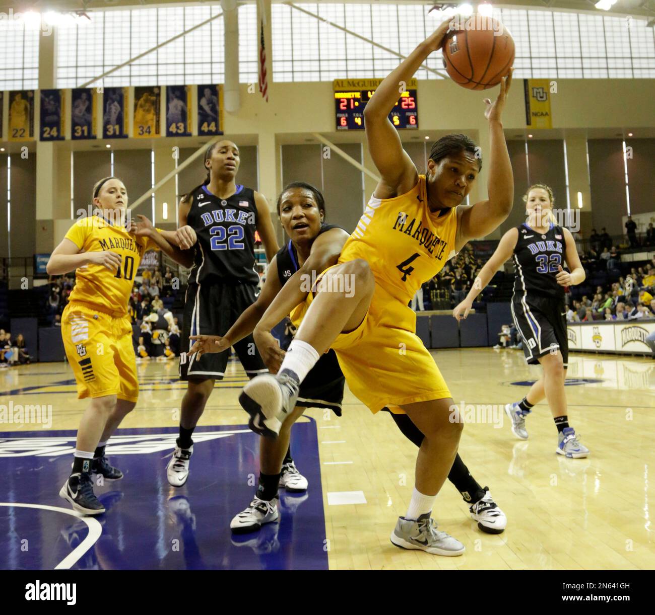 Marquette's Arlesia Morse, right, pulls down the rebound against Duke's ...