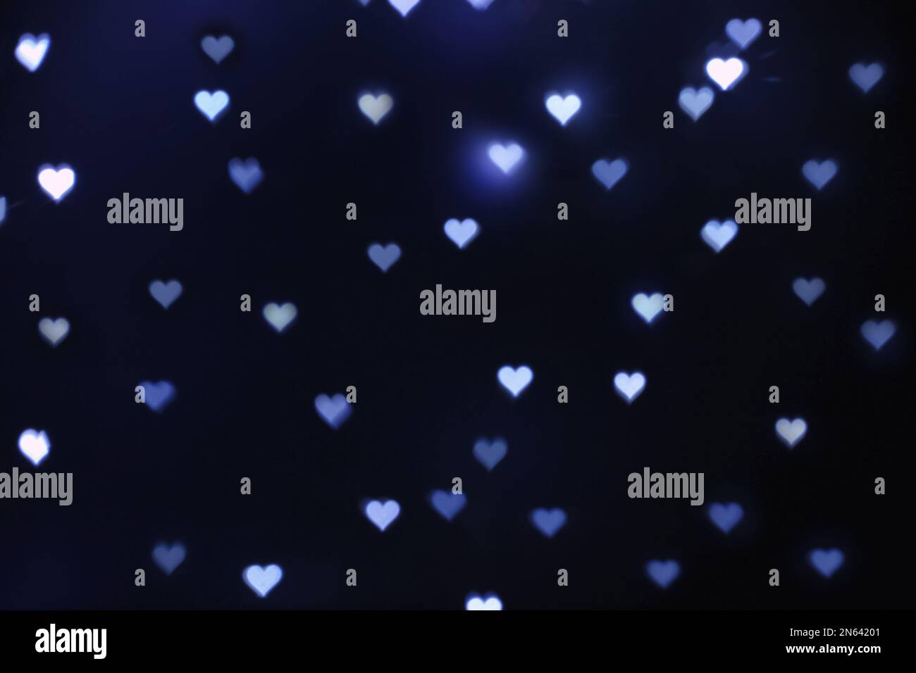 Beautiful heart shaped lights on dark background Stock Photo - Alamy