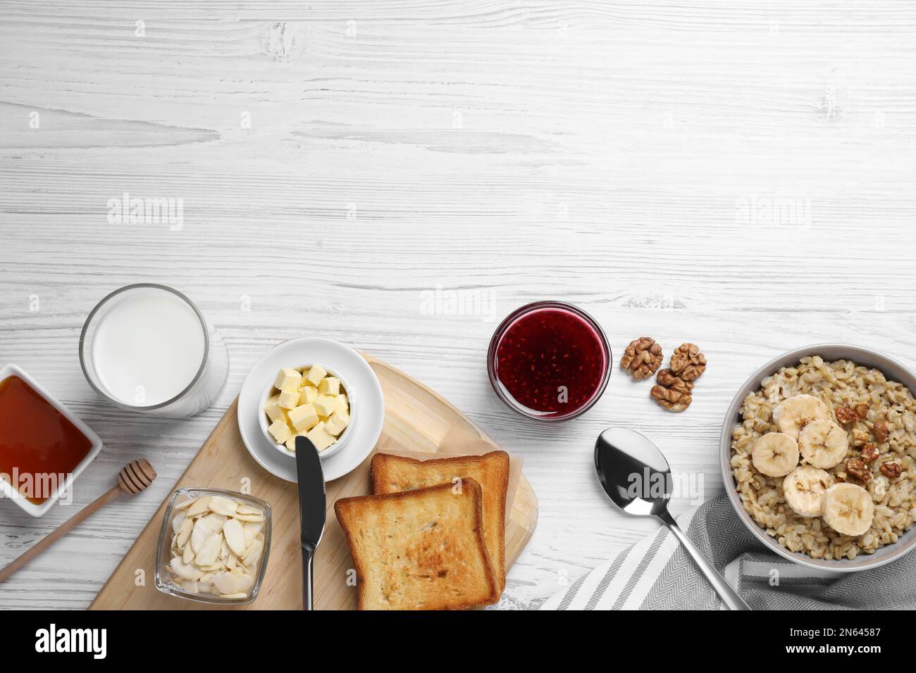 Flat lay composition with tasty breakfast food on white wooden table ...