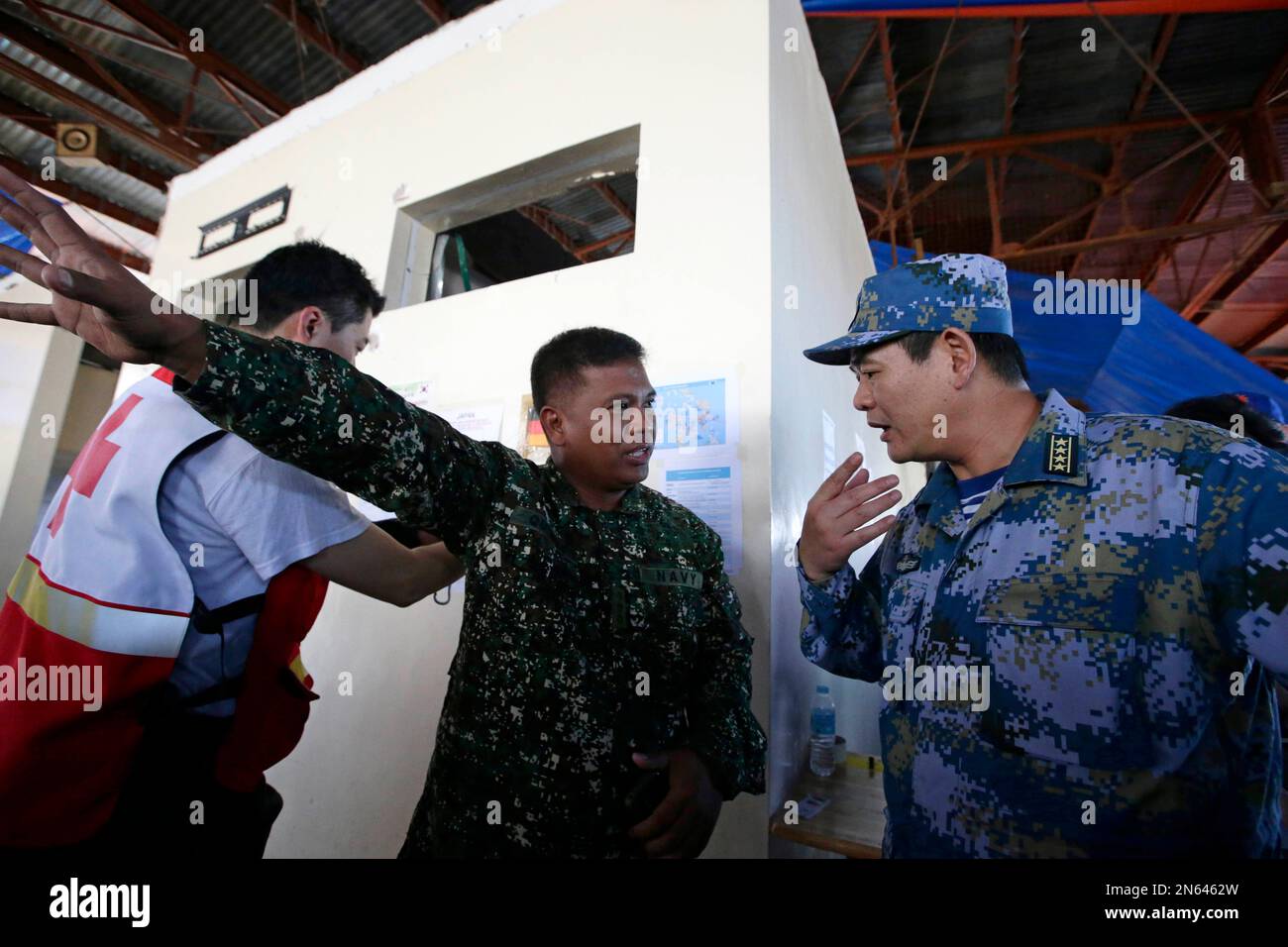 Chinese Navy Senior Col. Li Yuen Sheh, right, talks with Philippine ...