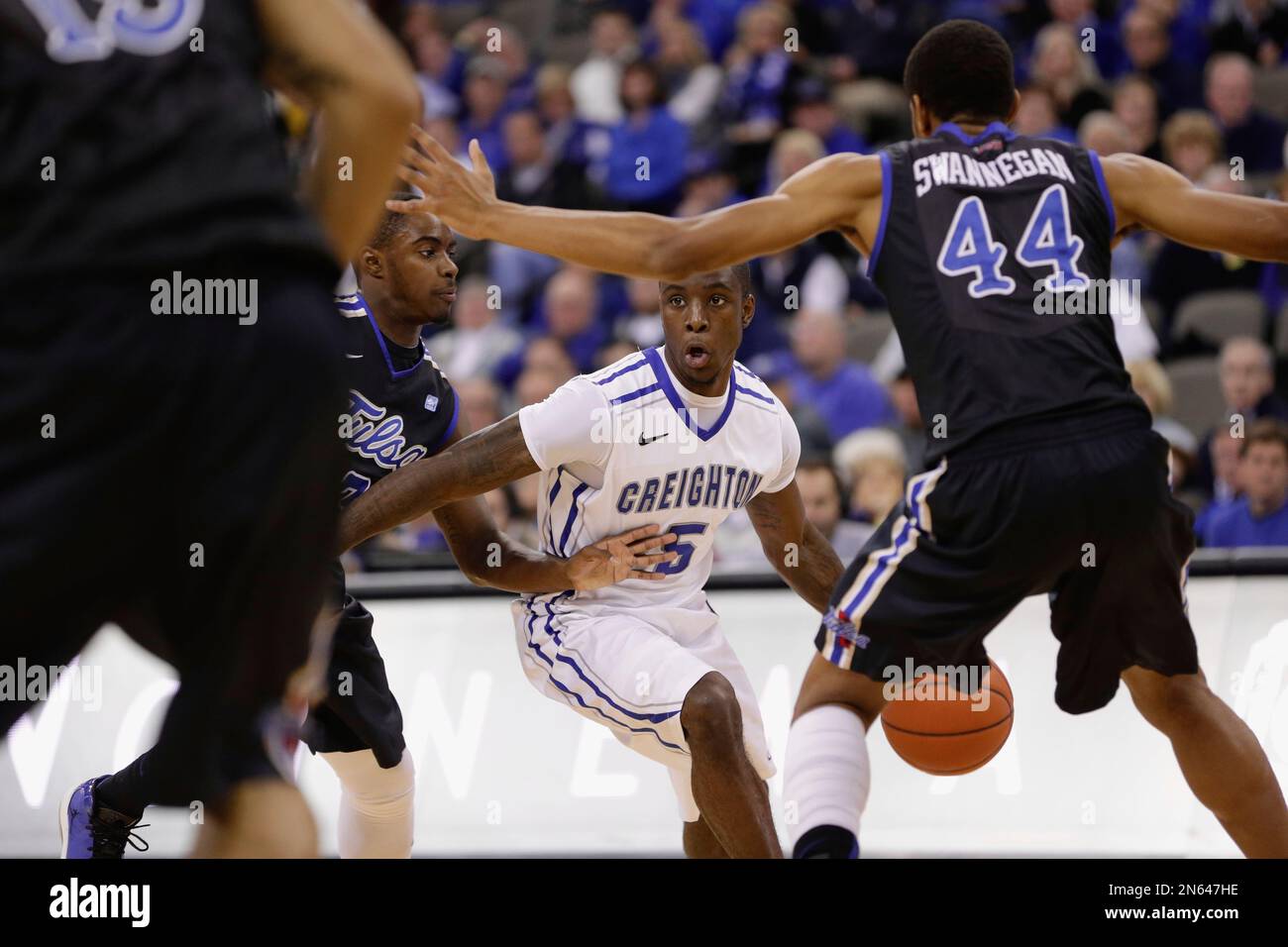 Creighton guard Devin Brooks (5) drives against Tulsa forward Brandon ...