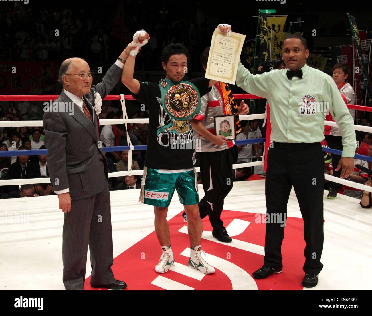Japanese champion Shinsuke Yamanaka is declared the winner after ...