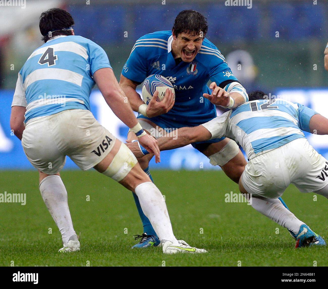 Italy's Alessandro Zanni, center, takes on Argentina's Manuel Carizza ...