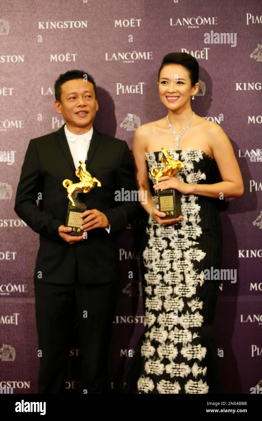 Best Leading Actor Lee Kang Sheng, left, and actress Zhang Ziyi hold ...