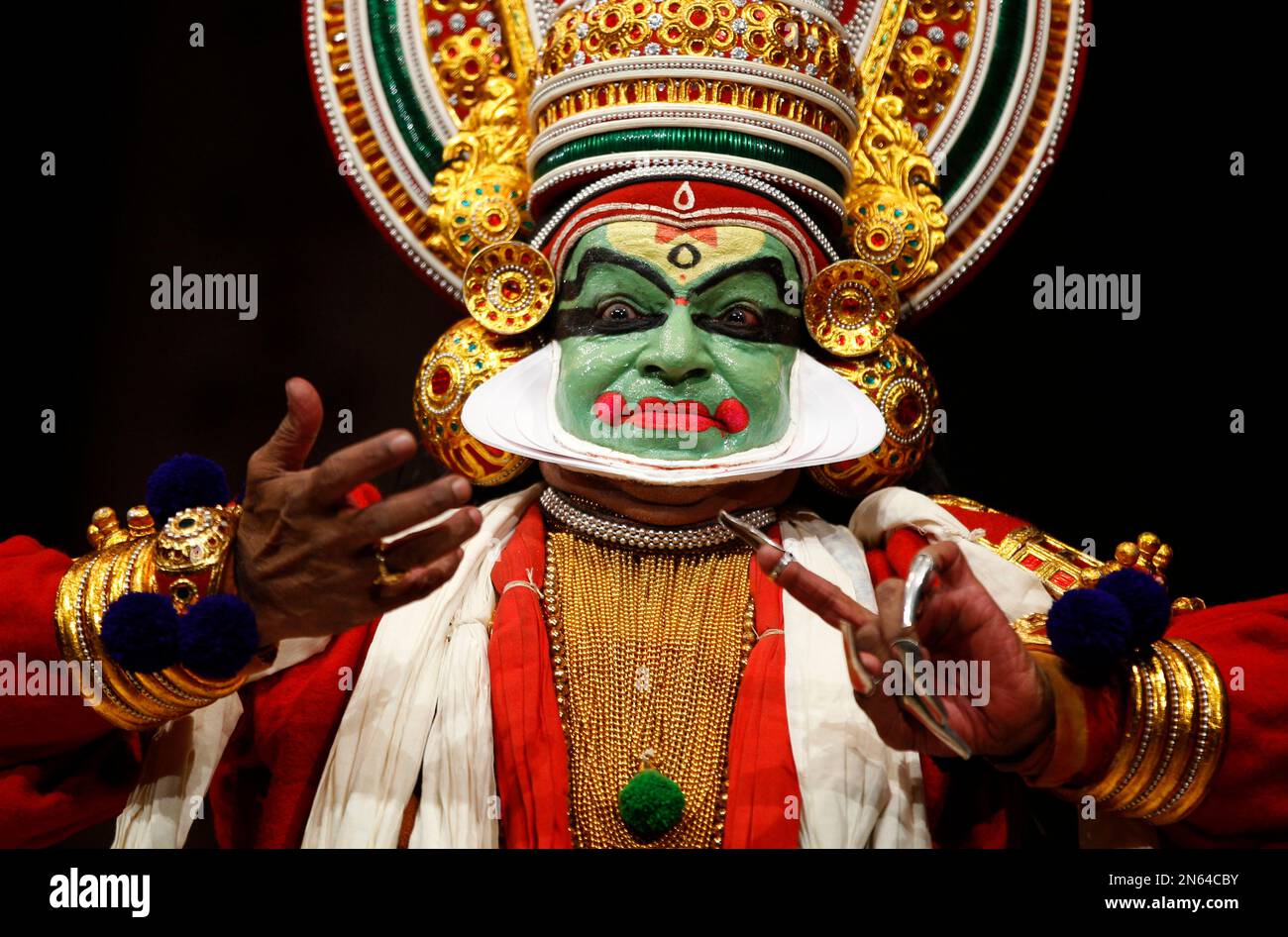 In this Friday, Nov. 22, 2013 photo, an Indian Kathakali artist ...