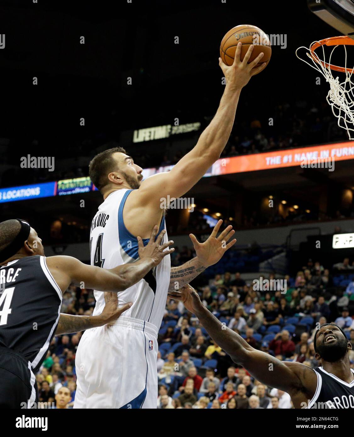 Minnesota Timberwolves' Nikola Pekovic of Montenegro lays up in the ...