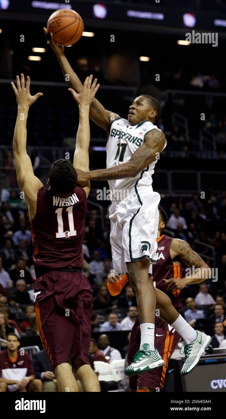 Michigan State's Keith Appling, right, drives past Virginia Tech's ...