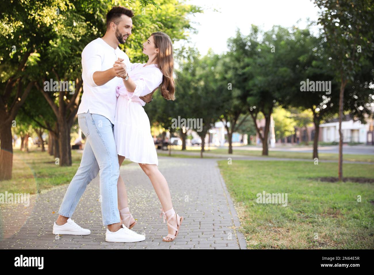 Passionate couple dancing outdoors cute hi-res stock photography and ...
