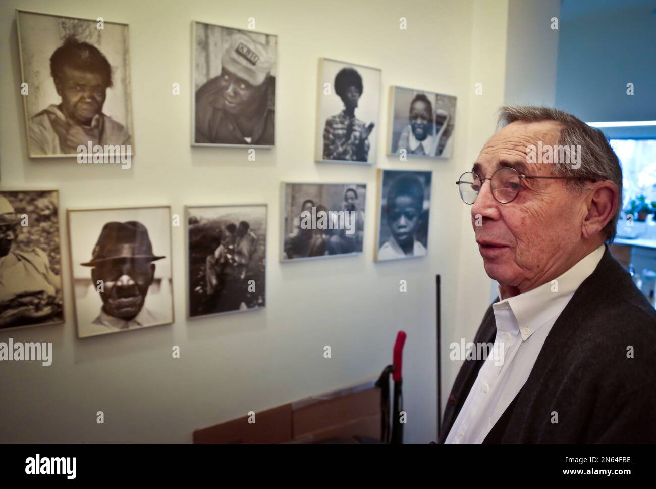 Dr. H. Jack Geiger, 87, stands next to his personal gallery of photos ...