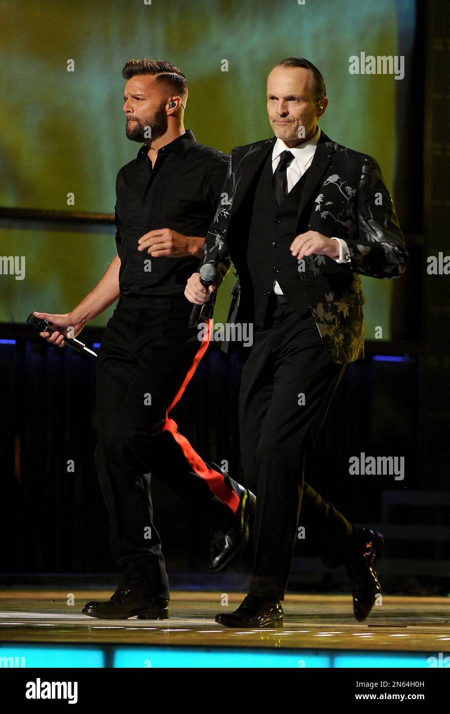 From left, Ricky Martin and Miguel Bose perform onstage at the 14th ...