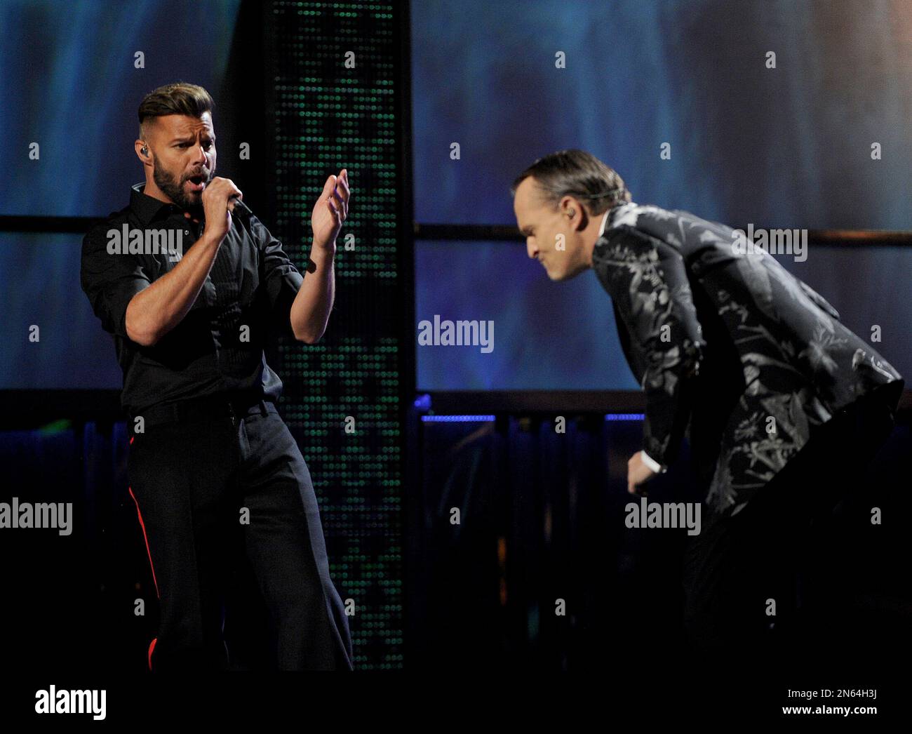 From left, Ricky Martin and Miguel Bose perform onstage at the 14th ...