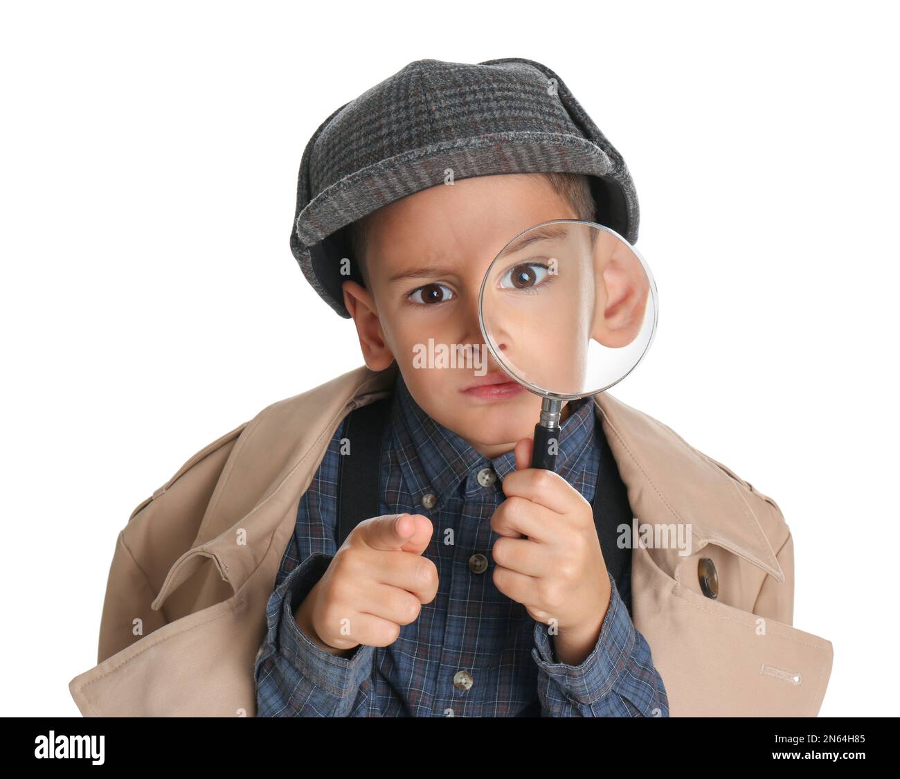 Little boy with magnifying glass playing detective on white background ...