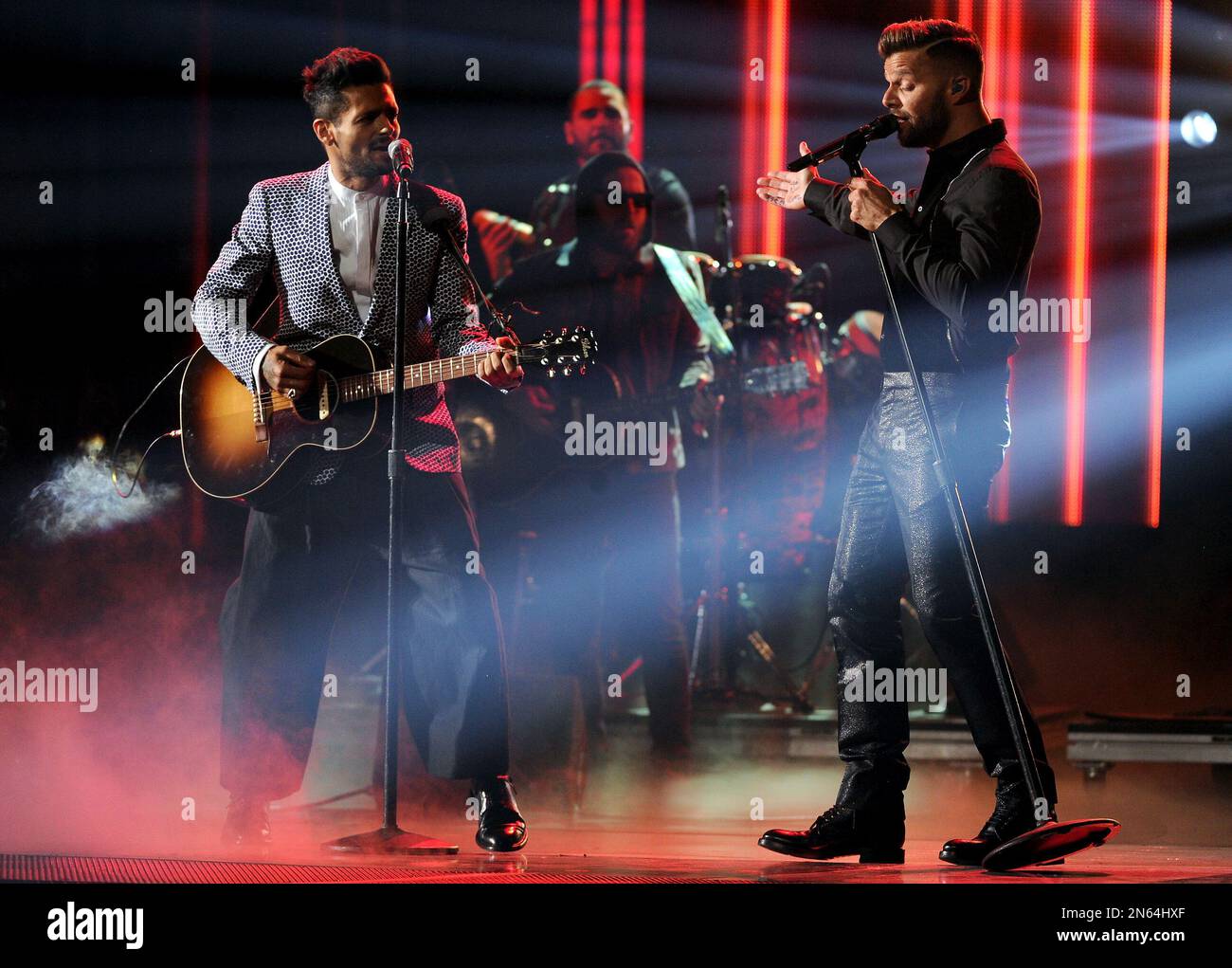 From left, musicians Draco Rosa and Ricky Martin perform onstage at the ...