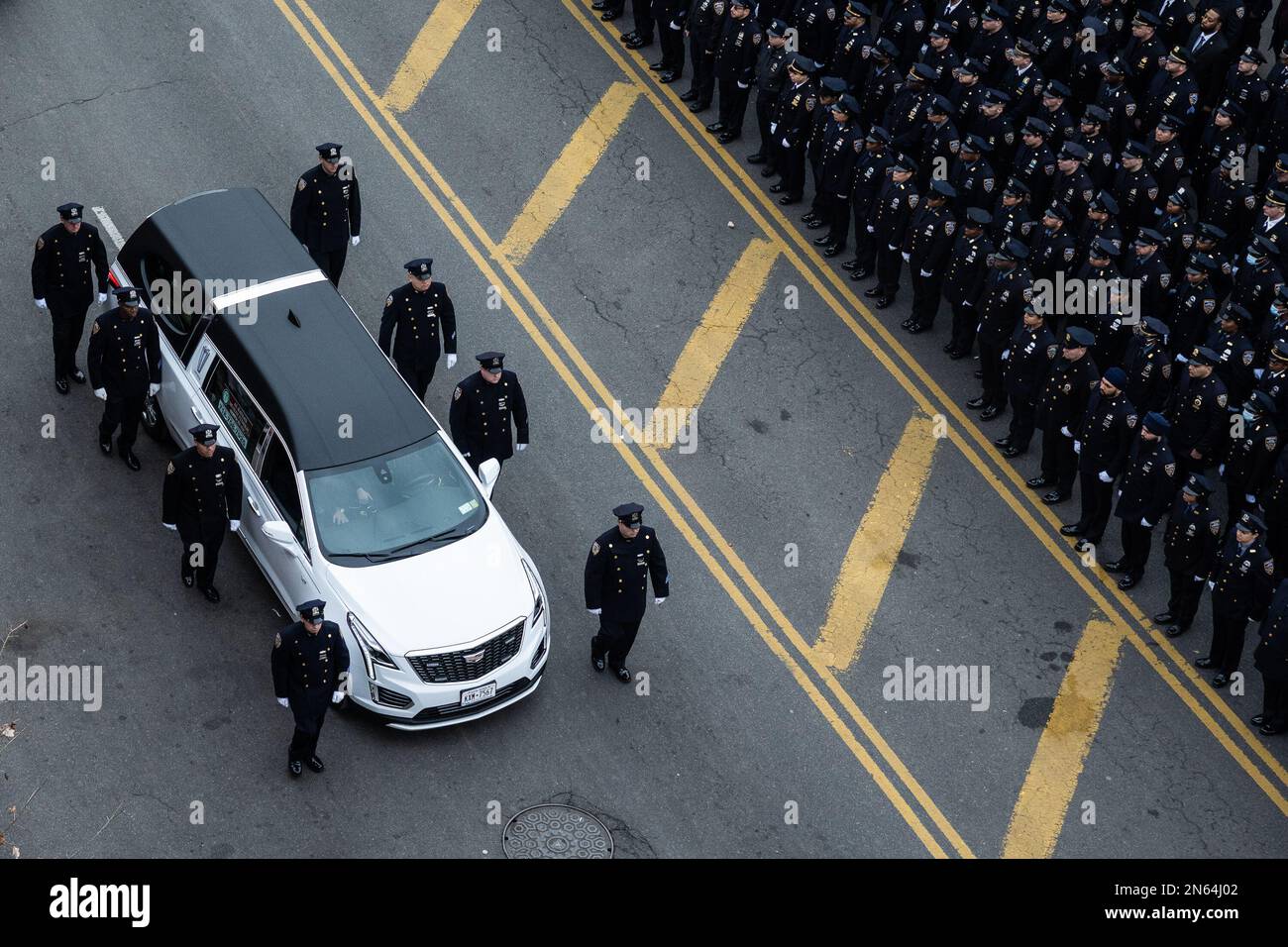 As the hearse with the casket of NYPD Officer Adeed Fayaz drives by ...