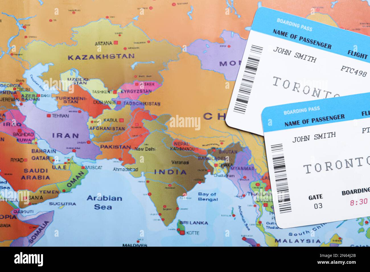 Avia tickets on world map, flat lay. Travel agency concept Stock Photo ...